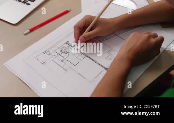 Slow motion interior designer drafting blueprint with customer ...