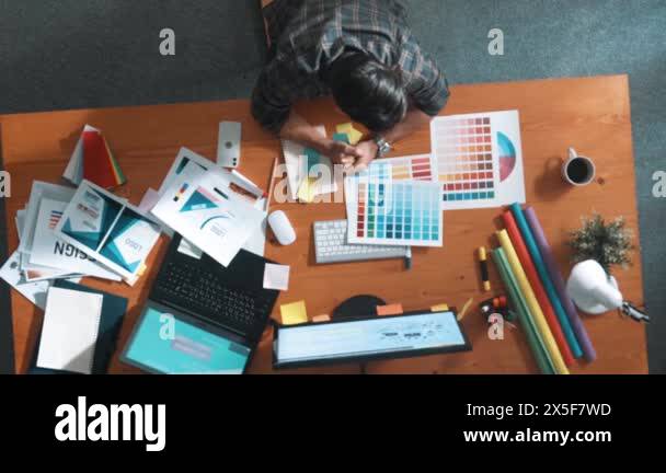 Top down aerial view of skilled interior design graphic while listen ...