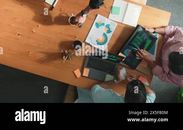 Smart project manager calling phone while diverse team brainstorm idea ...