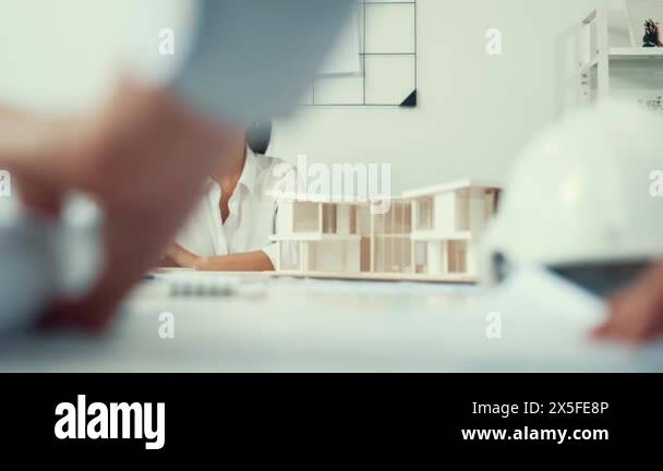 Professional asian male project manager hand puts the map on meeting ...