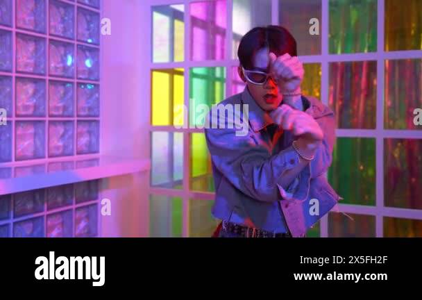 Happy dancer moving hands to hip hop music and standing at nightclub ...