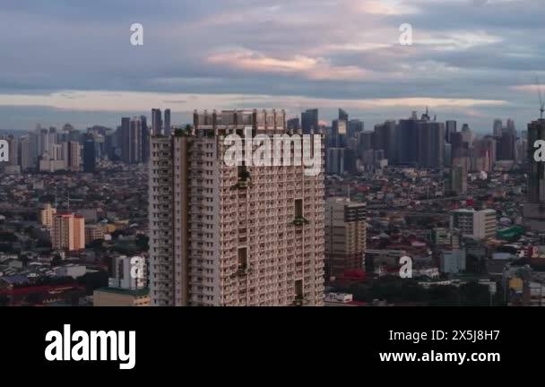 Fly around Torre de Manila building. Modern tall residential high rise ...