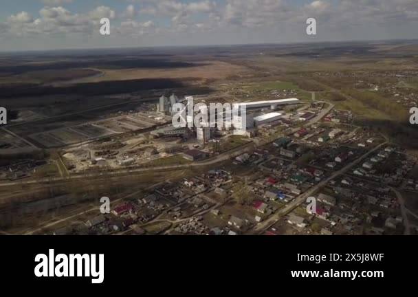 Birdseye view of factories in a small town, city, and rural area ...
