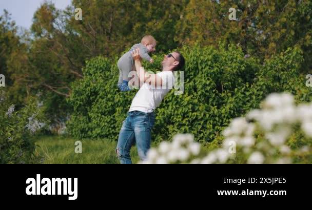 Man lifting his son Stock Videos & Footage - HD and 4K Video Clips - Alamy