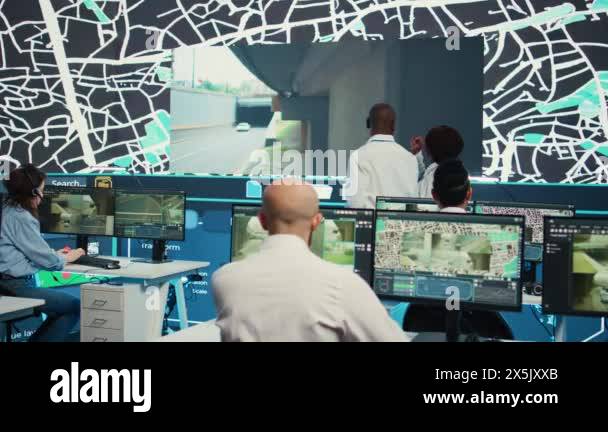 Employees team monitoring delivery cars in traffic via CCTV radar ...