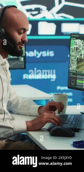 Vertical Video Middle eastern call center operator gives directions to ...
