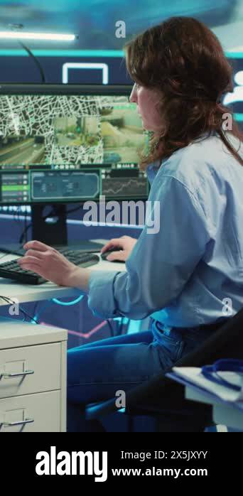 Vertical Video Monitoring room operator looking for routes on ...