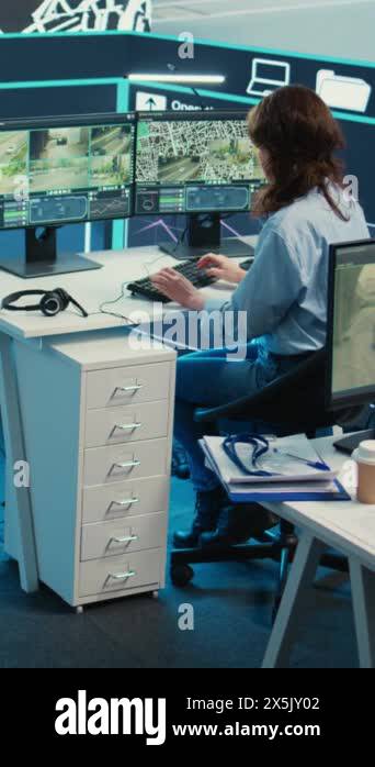 Vertical Video Monitoring room operator looking for routes on ...