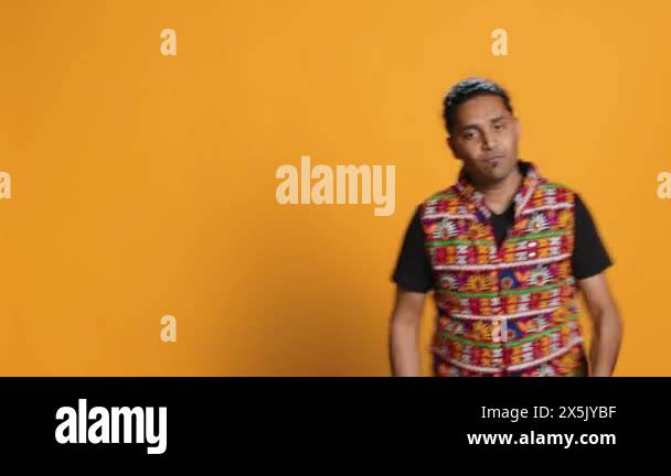 Ecstatic person wearing traditional indian attire doing energetic dance ...