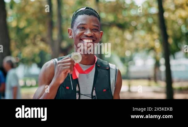 Black man, athlete and happy face with medal for winning or success ...