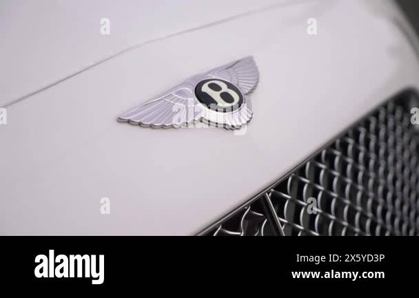 Bentley white luxury car logo on hood. Angel wings and B in circle ...