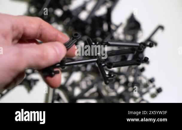 Constructing model from pieces of plastic. Man hobby Stock Video ...