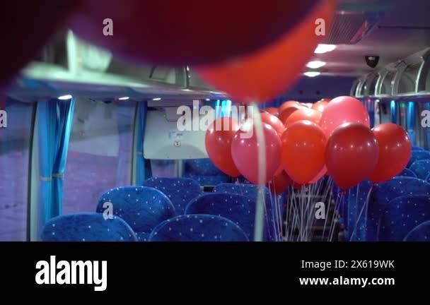 Red balloons in a bus Stock Video Footage - Alamy