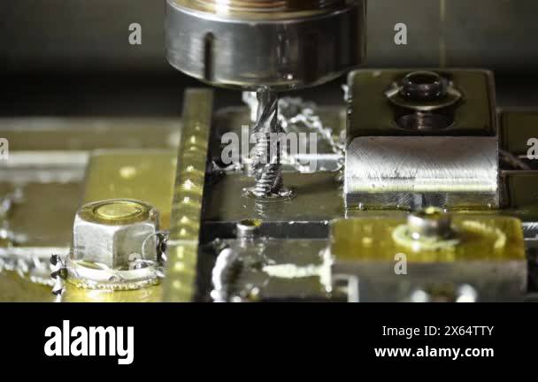 The tapping process on the CNC milling machine with tapping tools. The ...