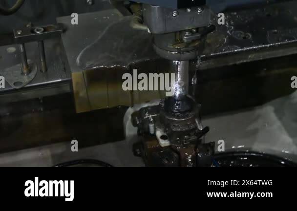 Closeup scene the wire EDM machine cutting the mold insert parts. The ...