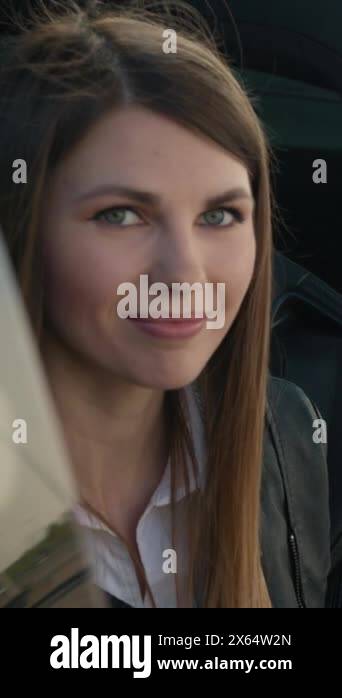 Vertical Screen: Portrait Charming woman sitting inside charging ...