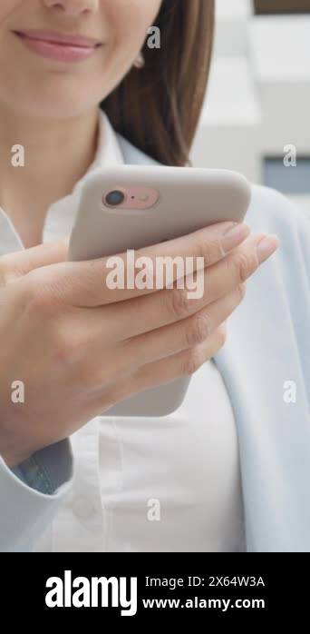 Vertical Screen: Appealing young elegant woman using social media ...