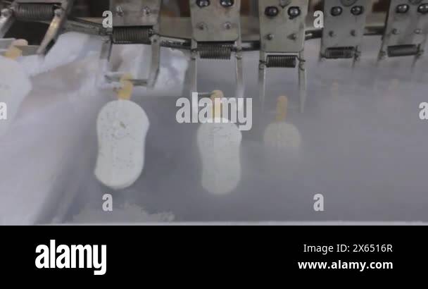 Freezing ice cream on the conveyor. Ice cream production process ...