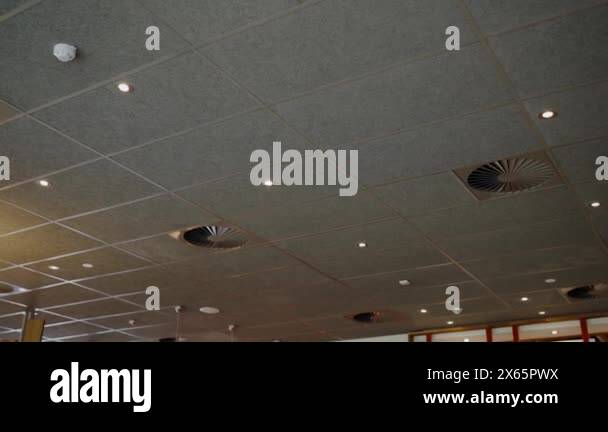 Interior image showing a detailed view of a modern ceiling with ...
