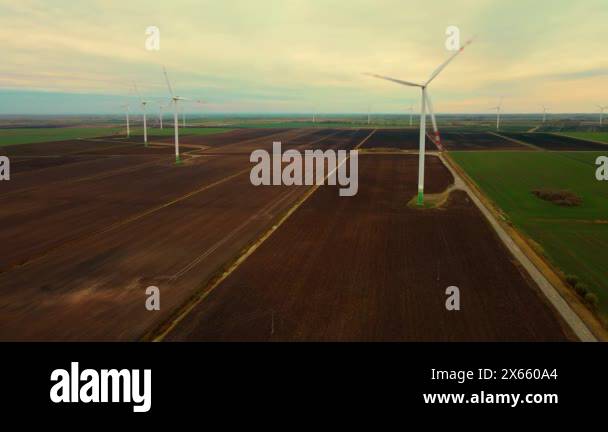 Multiple Wind Turbines in Field with Rotating Blades Generate Clean ...