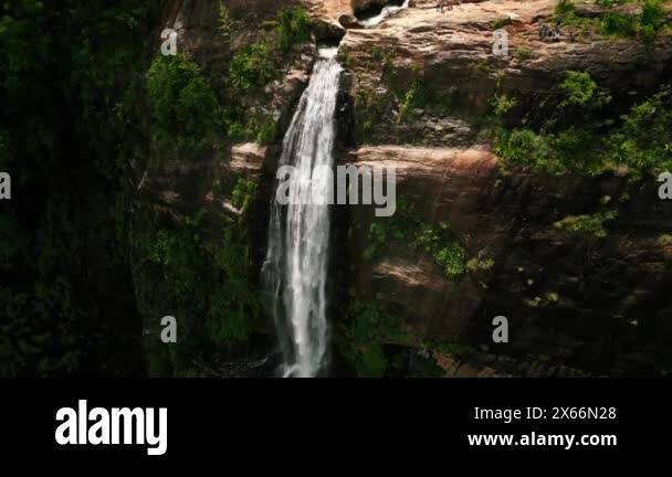 Sunshine enhances natural splendor. Drone view of Diyaluma Falls ...