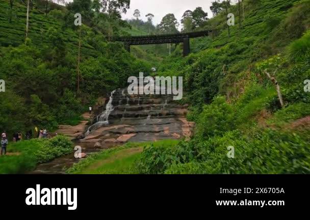 Train crosses historic bridge, scenic travel route in Sri Lanka. Drone ...