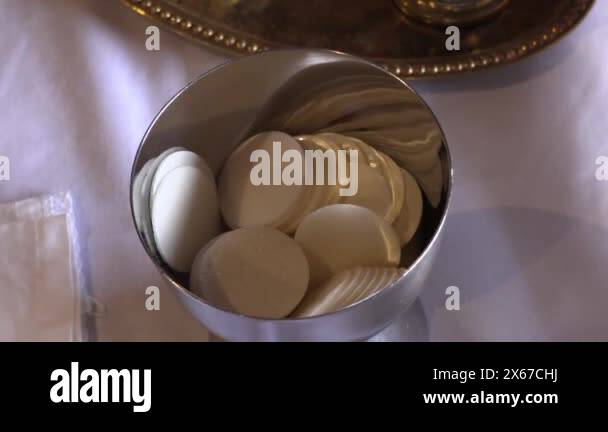Communion. Moment of the consecration of the cup with wafers on an ...