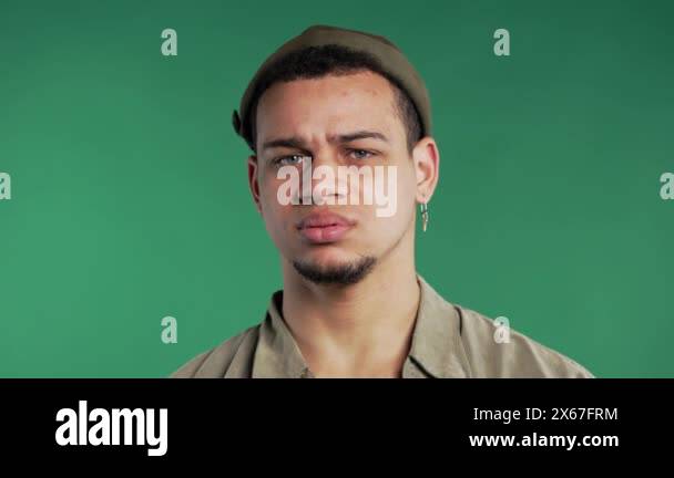 Serious multiracial man disapproving with no head sign, nods head ...