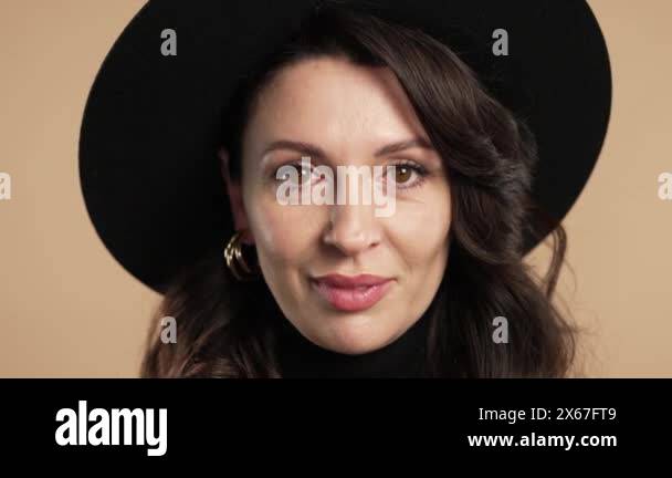 Gorgeous woman in stylish outfit showing yes signal, nods head, approve ...