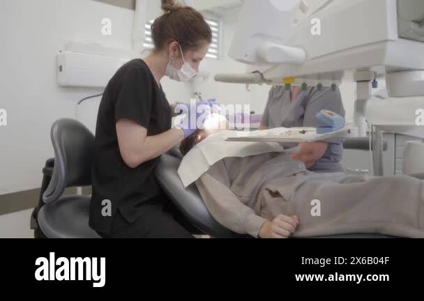 Dental treatment for caries. After placing the filling, the pediatric ... Dental treatment for caries. After placing the filling, the pediatric ...
