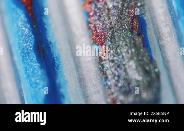 Sparkling paint drip. Wet glitter spill. Defocused silver blue red ...