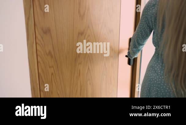 Young confident woman applicant opens door, enters modern conference ...