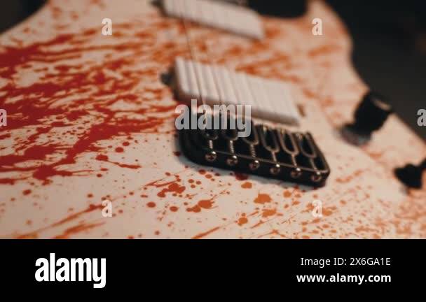 white guitar with red spots, musical instrument concept, closeup shot ...