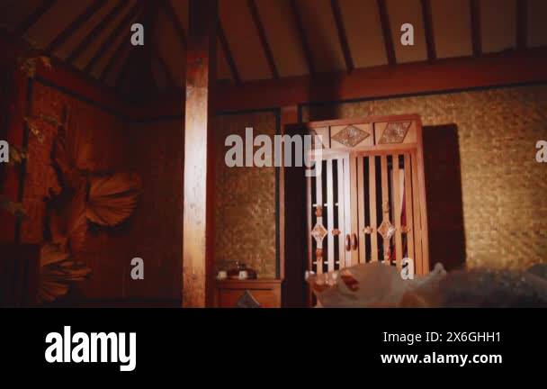 Traditional Asian interior with wooden beams and decorative screen door ...