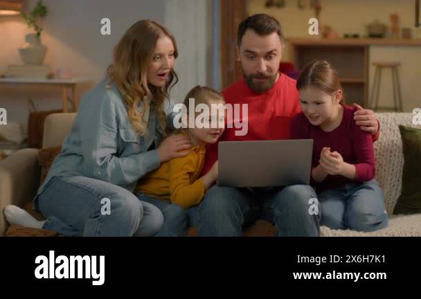 Happy excited Caucasian family winners mom dad little children girls ...