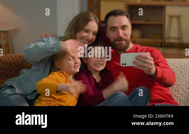 Happy Caucasian family talking mobile phone video call webcam cheerful ...