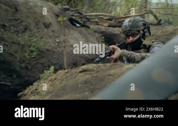 Two male soldiers or military men in camouflage uniform and helmets ...