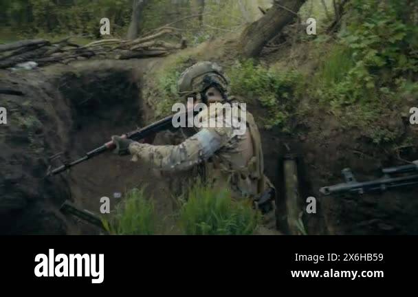 Assault on enemy positions. Two Ukrainian male soldiers or military men ...