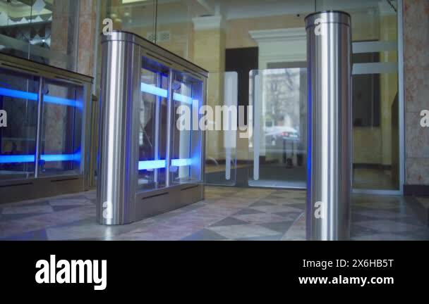 African American employee or businessman walks through gates and leaves ...