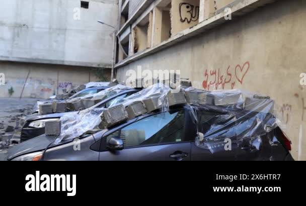 Consequences of explosion and cars were buried under rubble of concrete ...