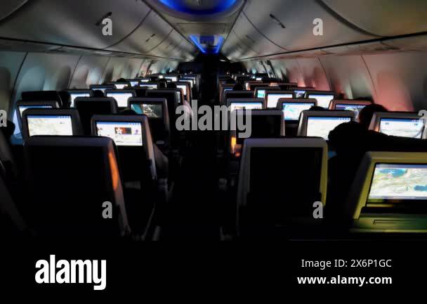 Inside View of an Airplane Cabin at Night, Nighttime inside view of an ...