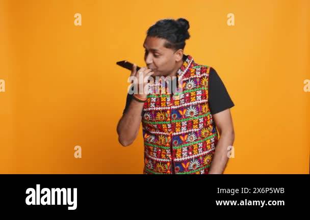 Irked indian man fighting with friends during telephone call, isolated ...