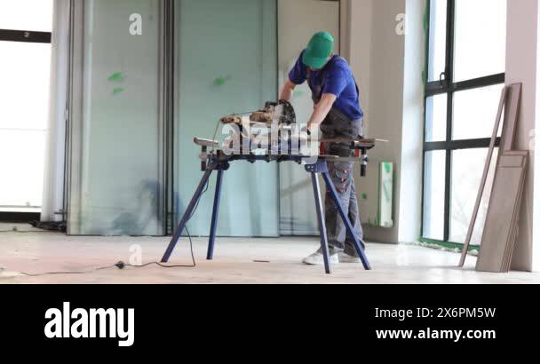 Cutting master with circular saw cut piece of wooden laminated shelf in ...