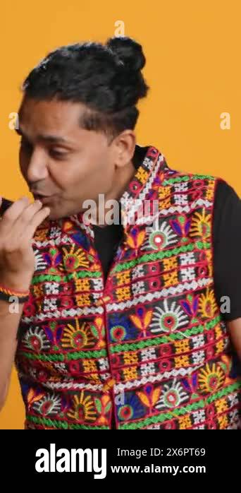 Vertical video Irked indian man fighting with friends during telephone ...