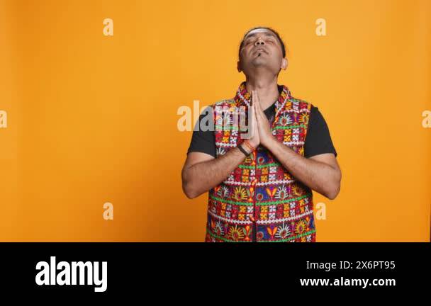 Pious indian man praying to his god, asking for forgiveness. Spiritual ...