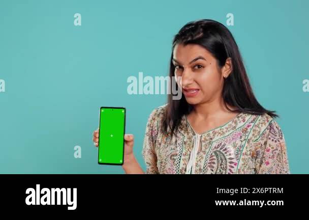 Tech content creator doing influencer marketing using green screen ...