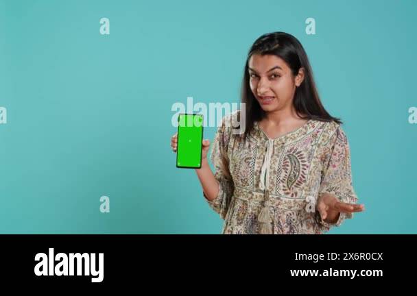 Tech content creator doing influencer marketing using green screen ...