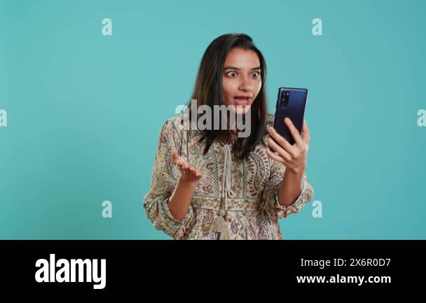 Irked woman fighting with friends during smartphone videocall, isolated ...