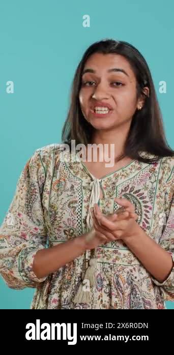 Vertical video Portrait of envious indian woman mockingly clapping ...