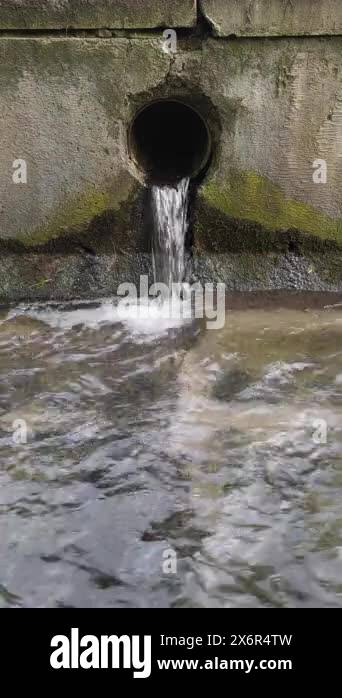 Water flows from the pipe into the river, drainage water in stormdrain ...